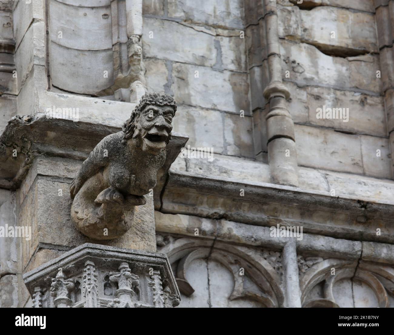 Monstrous statue with almost human features called gargoyle on the ...
