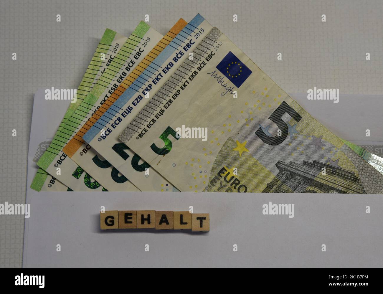 the german word for salary with wodden bricks and euro bank notes Stock ...