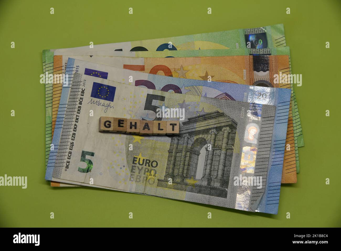 the german word for salary with wodden bricks and euro bank notes Stock ...