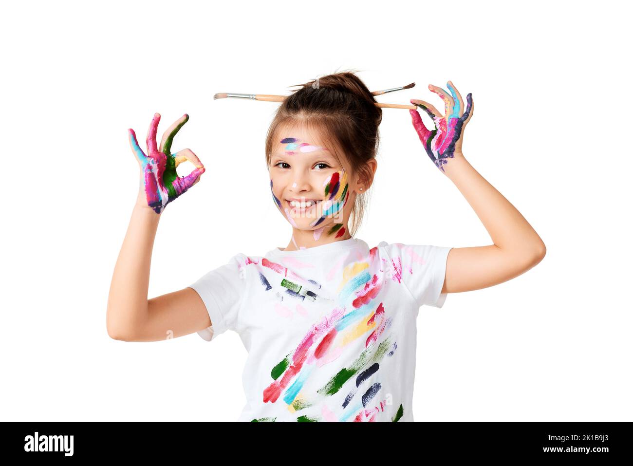 child girl with hands painted in colorful paint make heart shape Stock ...