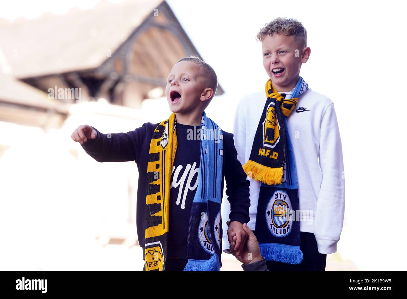 Young fans wearing half and half scarves ahead of the Premier League ...
