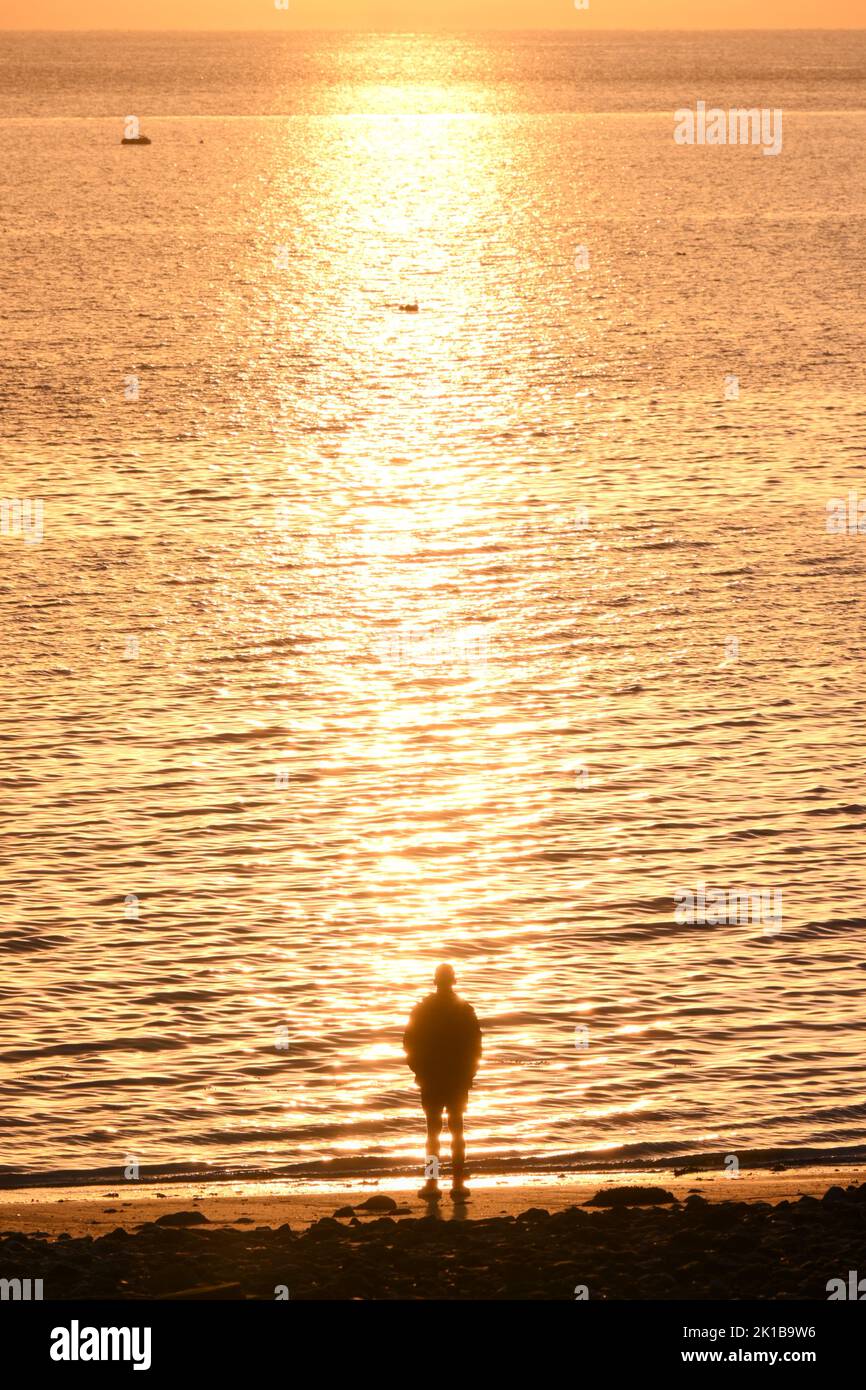 Sunrise over ocean an man hi-res stock photography and images - Alamy