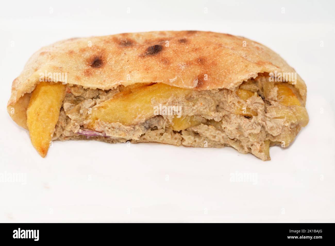 Traditional Egyptian fried potatoes fingers sandwich mixed with baba ...