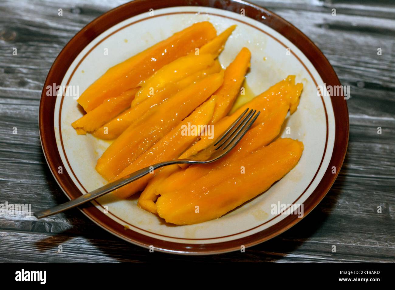 Plate of Egyptian fresh mango fruit with tropical delicacy, mangoes are ...