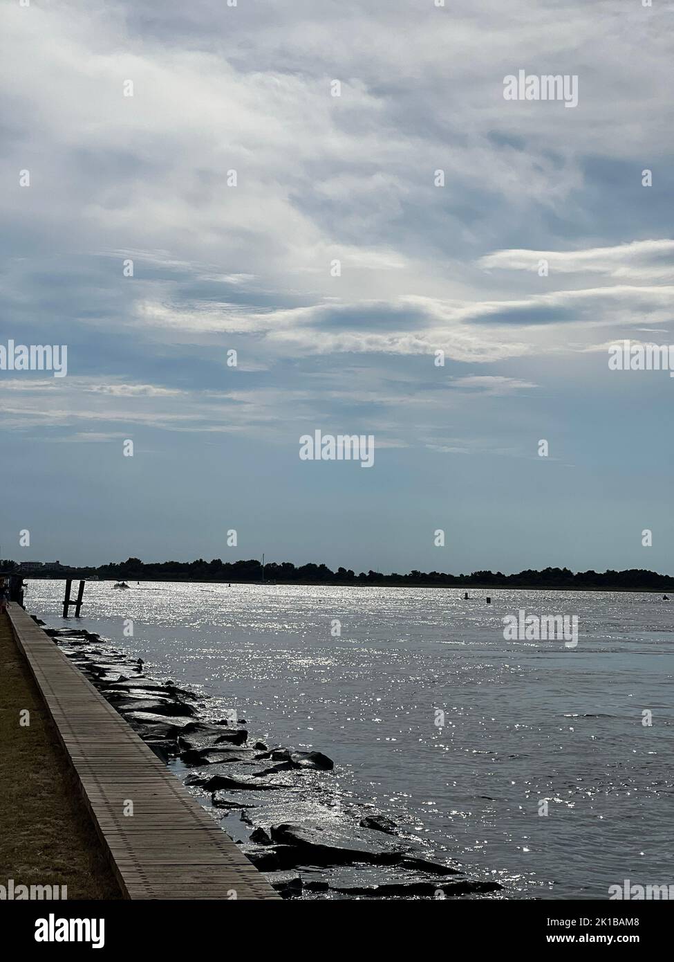A vertical shot of a beach scenery on a cloudy day Stock Photo - Alamy
