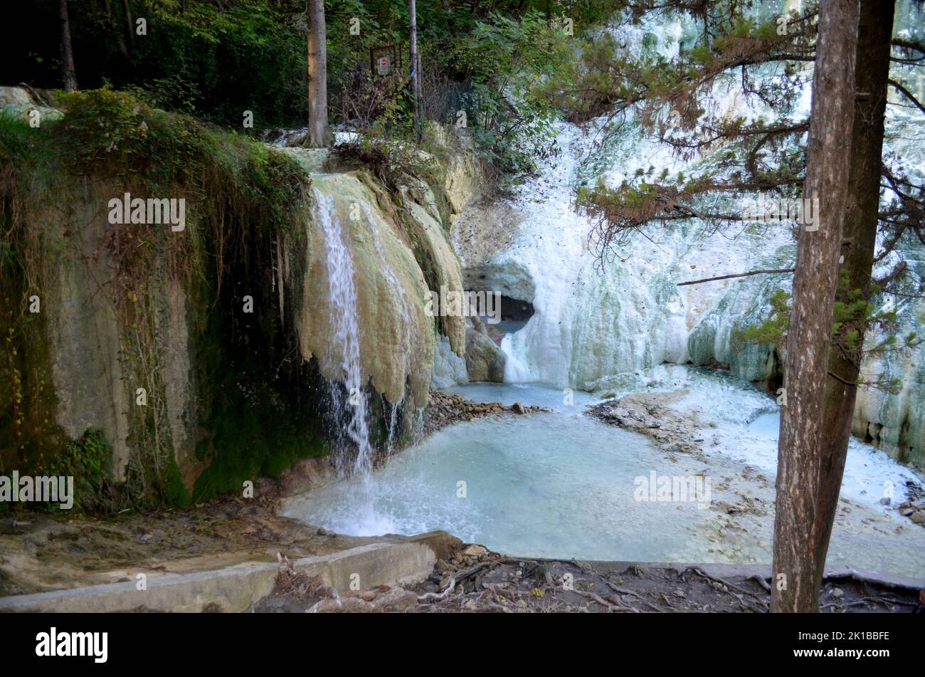 Water flowing into a murky milky geothermal natural hot spring in Italy ...