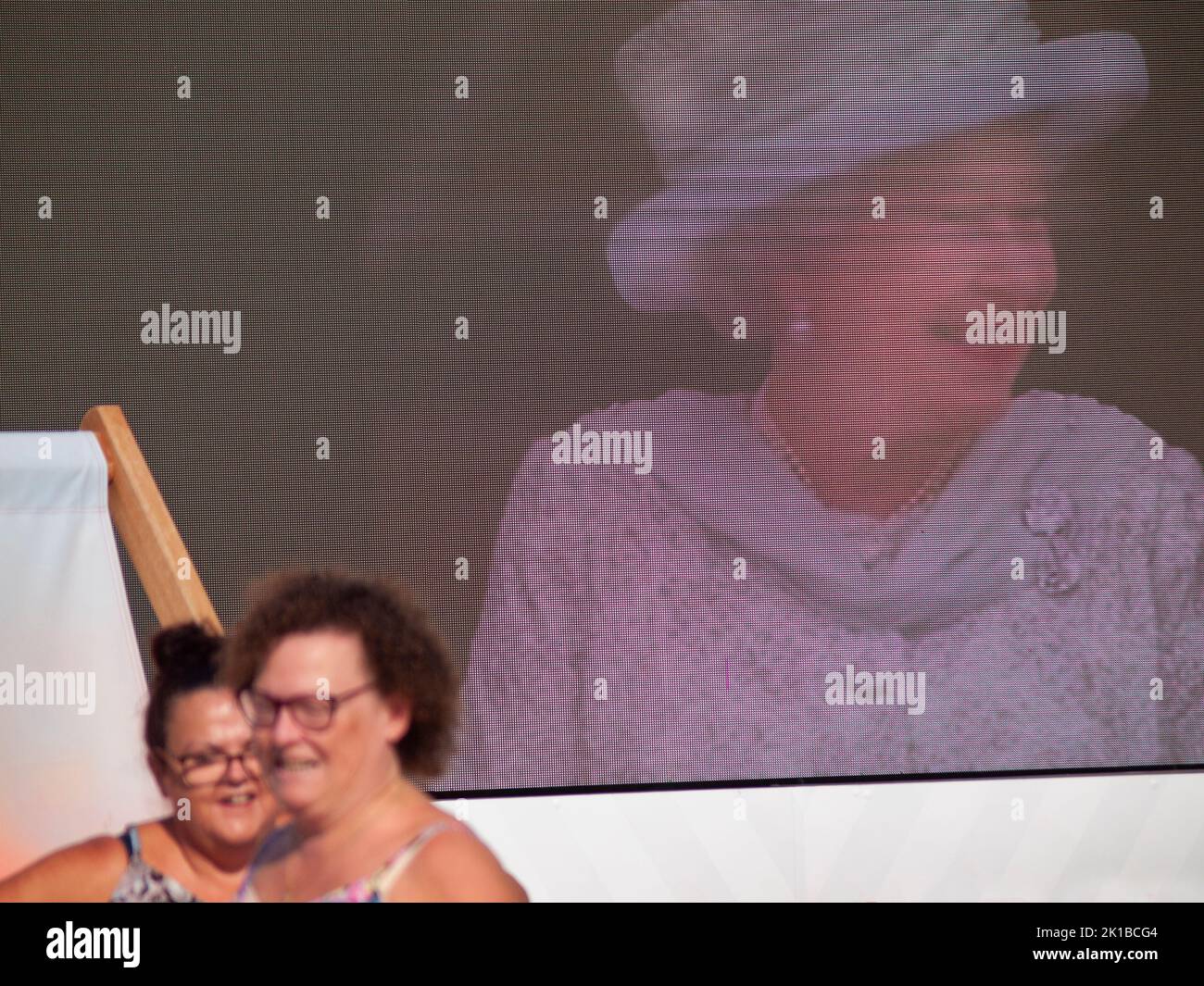 The Queen on a big public screen in Brighton Stock Photo - Alamy