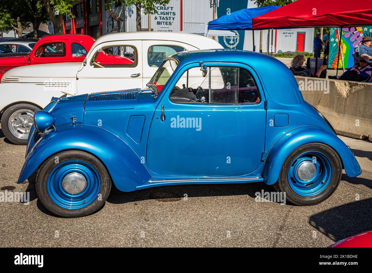 Falcon Heights, MN - June 18, 2022: Low perspective side view of a 1947 Fiat 500 Topolino Coupe ...