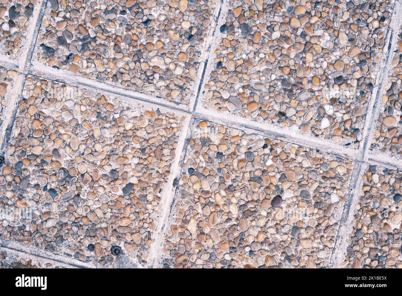 Brown and white pebble stone floor texture, small rocks tile pavement ...