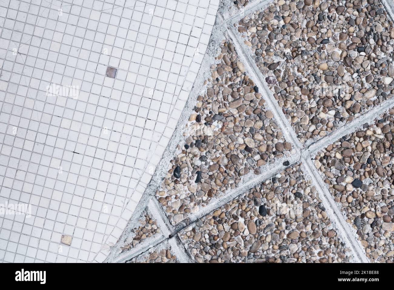 Half of small white and dirty squared ceramic tiles and old brown ...