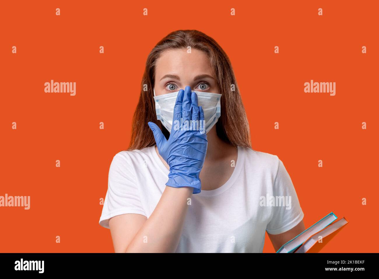 School reopen. Quarantine education. Scared female student covering ...