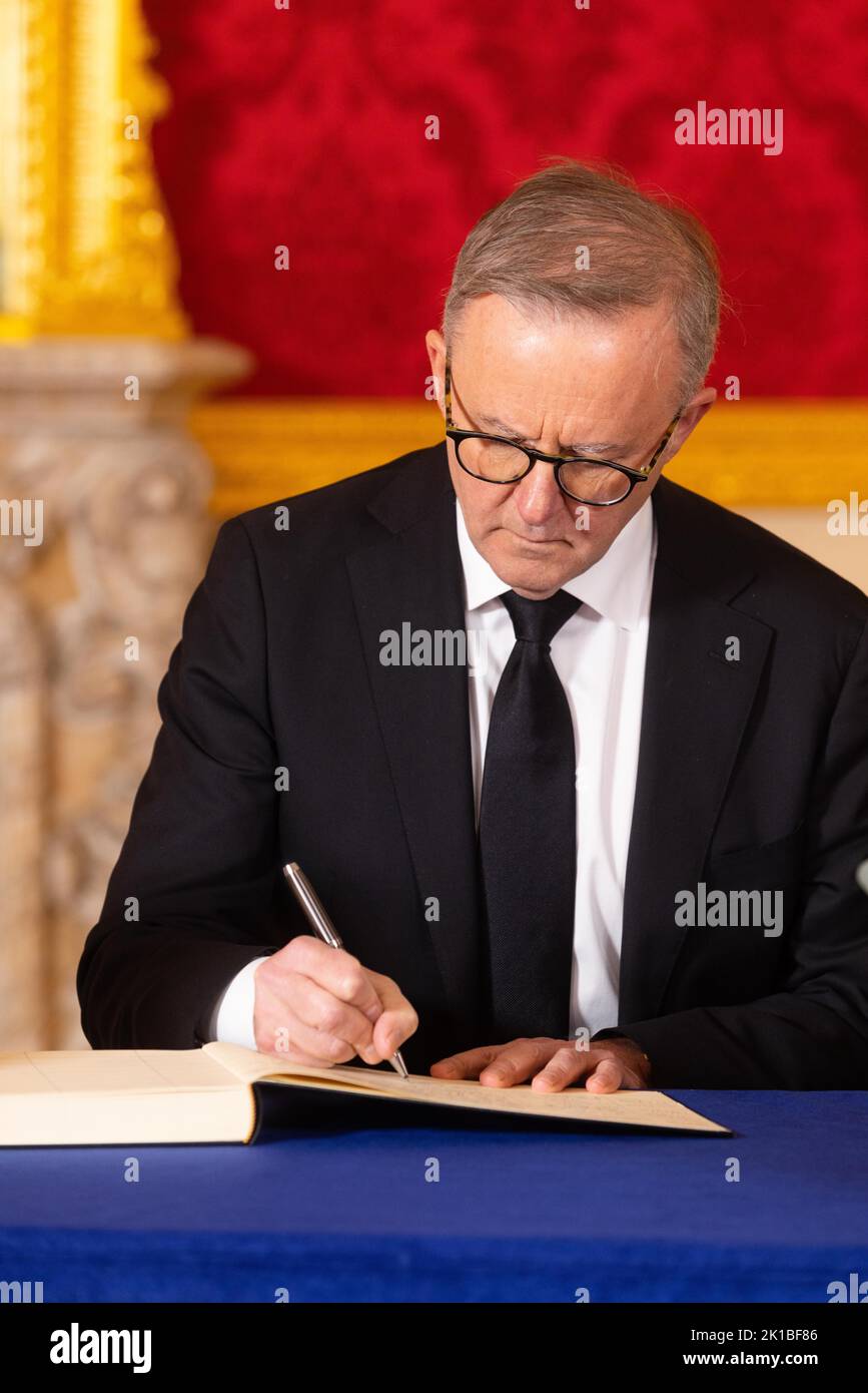 Prime Minister of Australia, Anthony Albanese, signing a book of ...