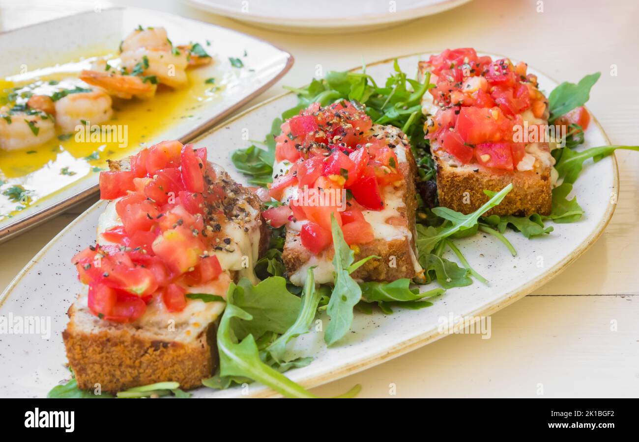 Italian bruchetta with fresh tomato, pepper and rocket salad Stock ...
