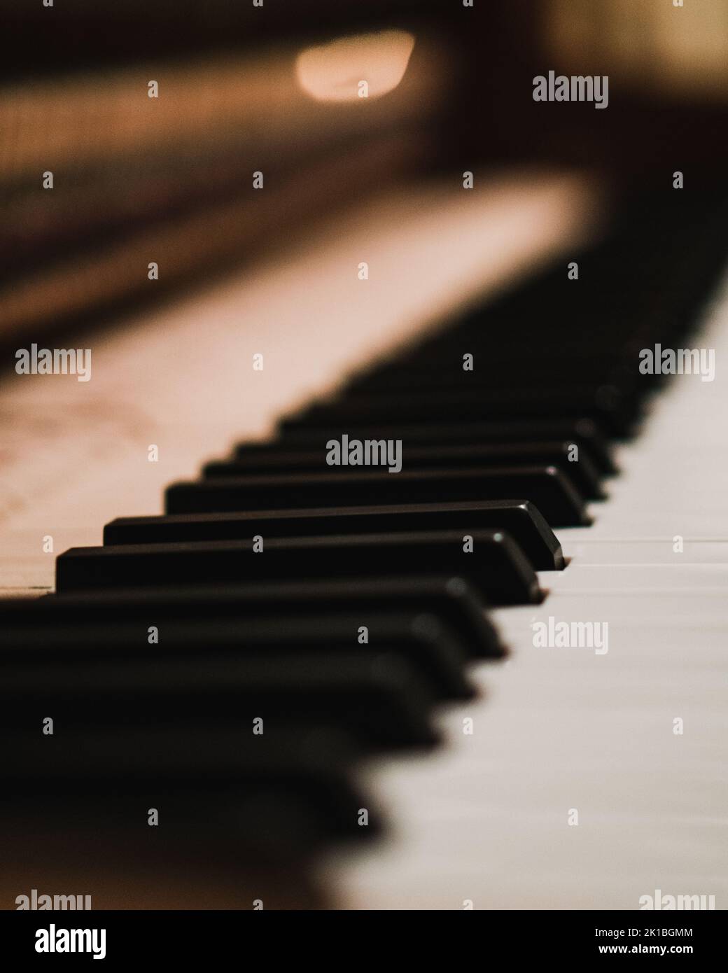 A vertical closeup of a piano keyboard Stock Photo - Alamy