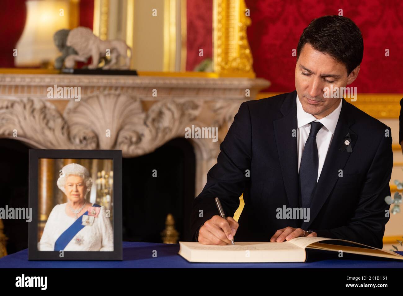 Prime Minister of Canada Justin Trudeau signs a book of condolence at ...