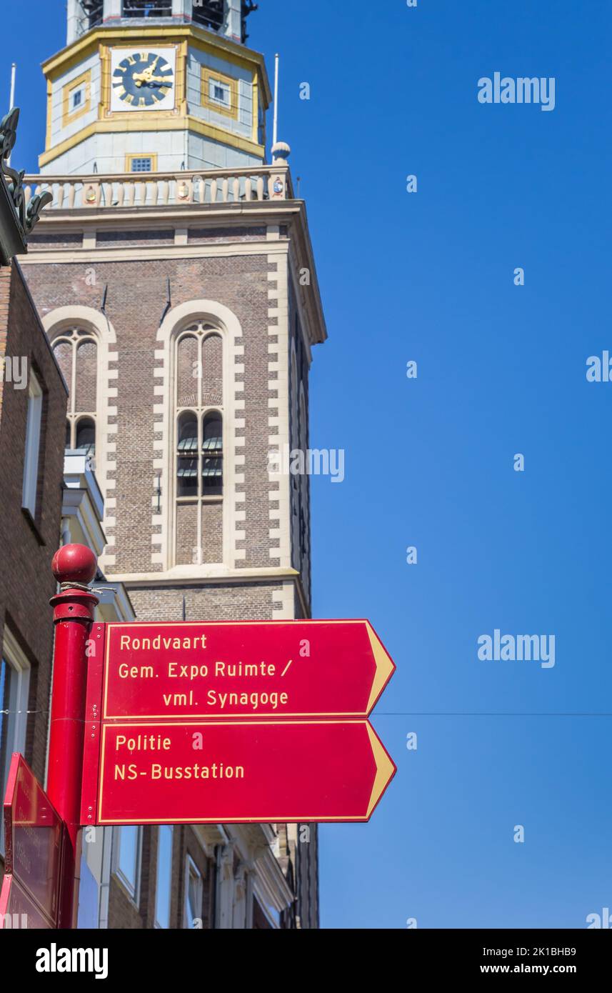Tourist sign in front of the historic tower of Kampen, Netherlands ...
