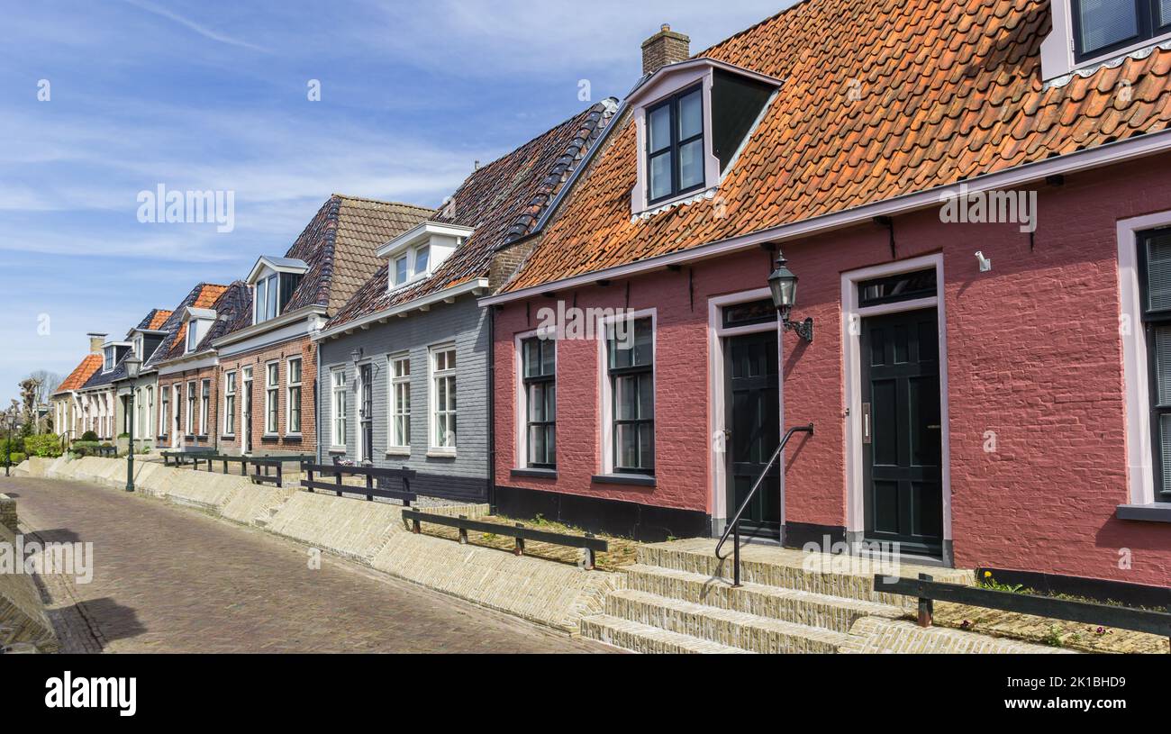 Colorful traditional houses in the small village Holwerd, Netherlands ...