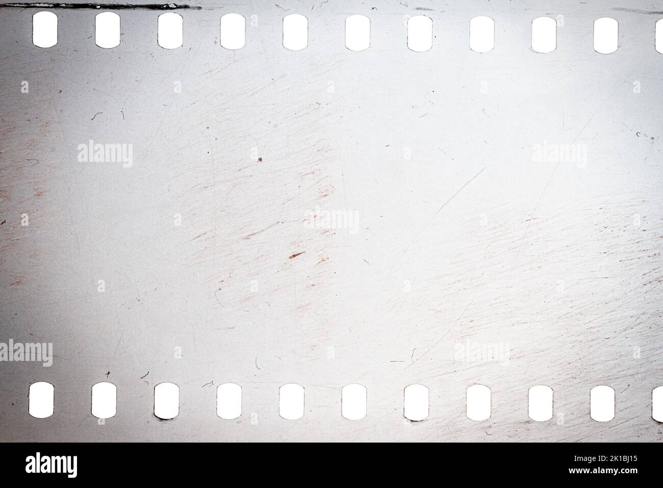 Dusty and grungy 35mm film texture or surface. Perforated scratched ...