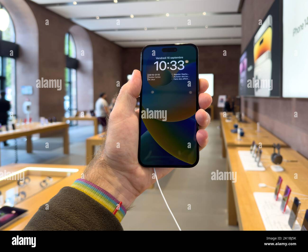 Paris, France - Sep 16, 2022: POV male hand holding new Apple Computers ...