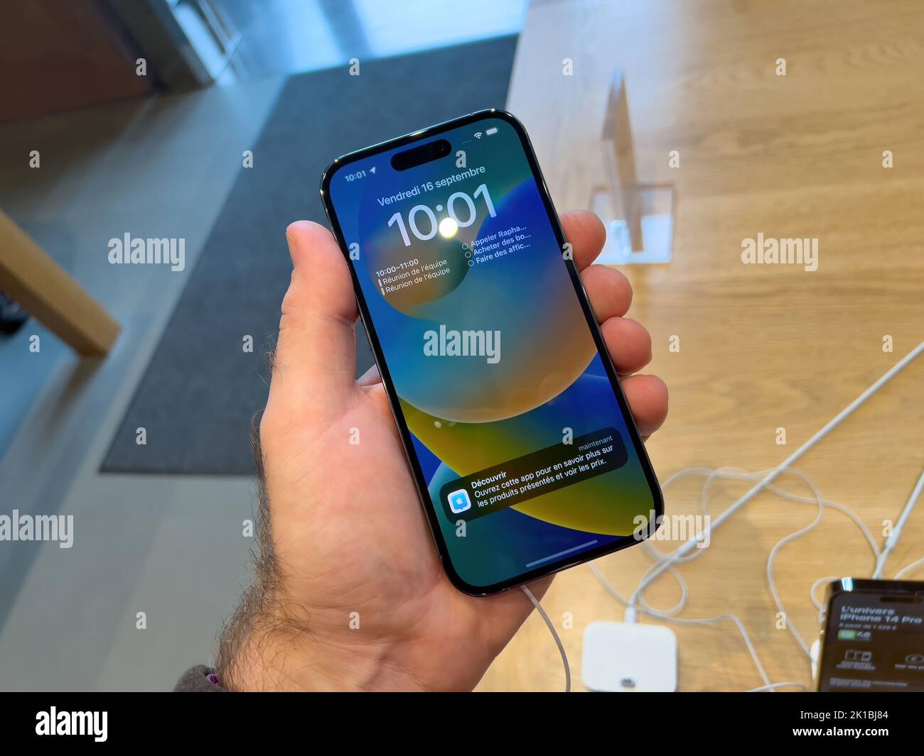 Paris, France - Sep 16, 2022: Always-on display - POV holding in hand ... Paris, France - Sep 16, 2022: Always-on display - POV holding in hand ...