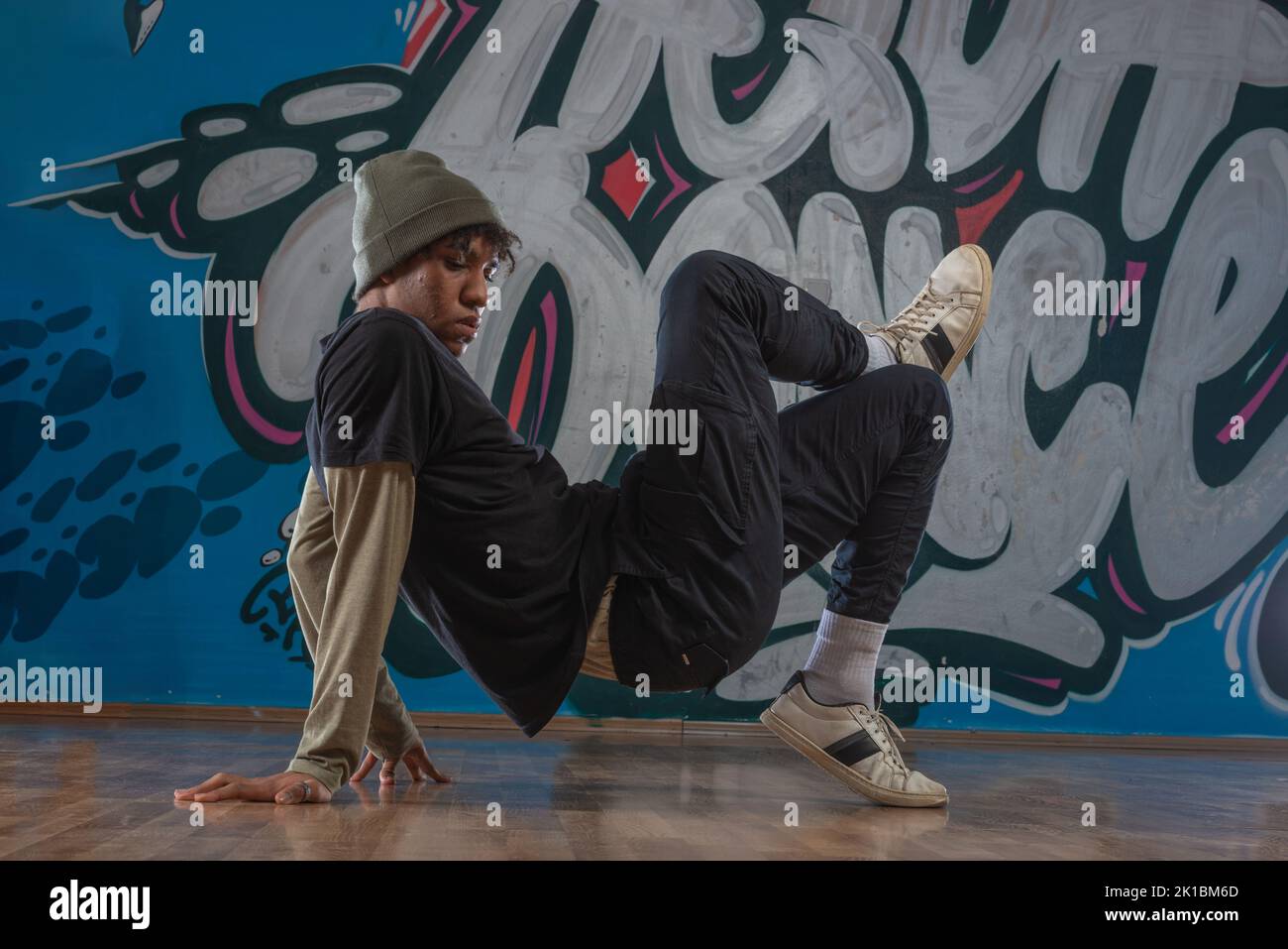 Modern rapper dancing in garage. Urban lifestyle, hip hop Stock Photo ...