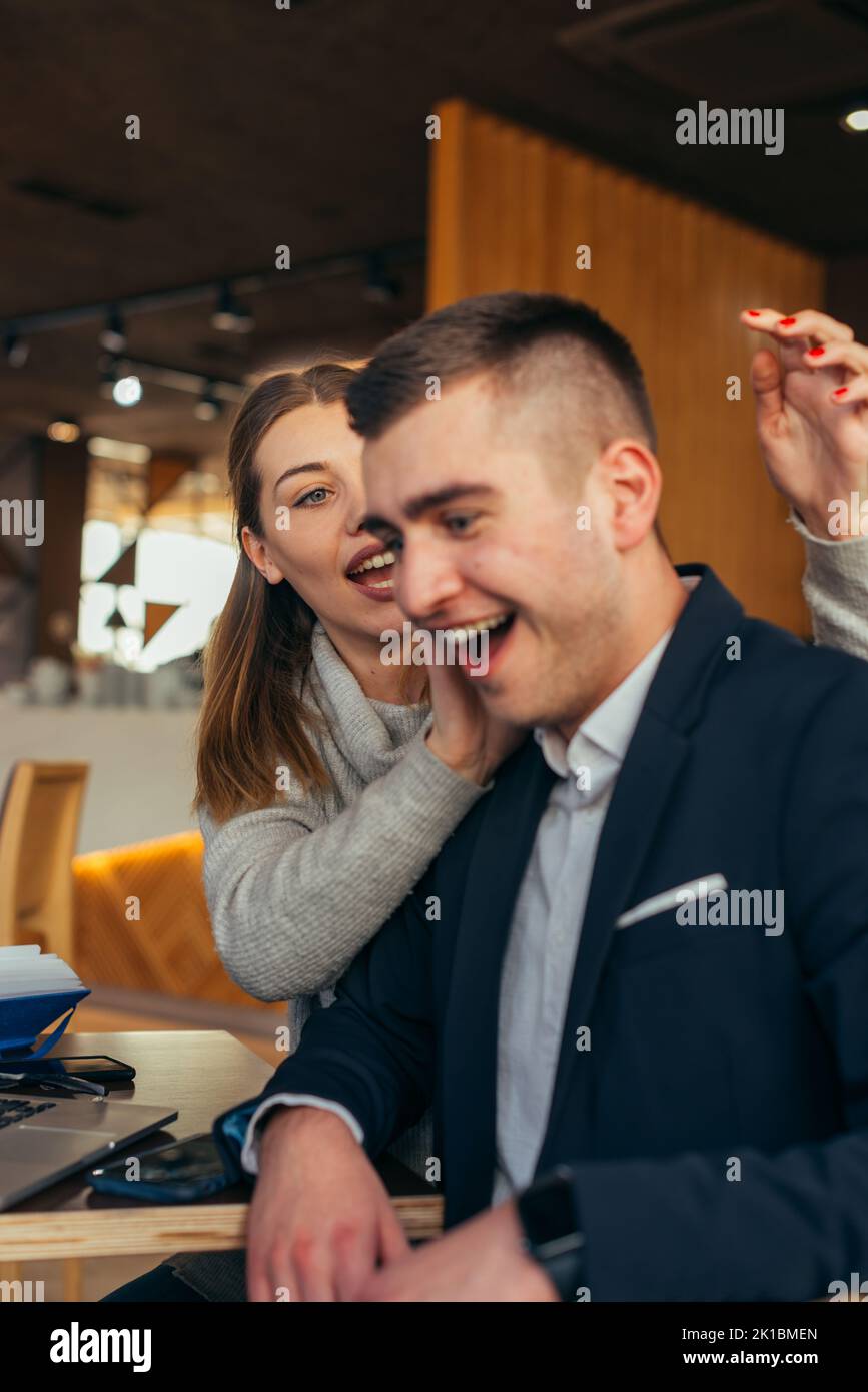 Couple having fun in a cafe ( coffee shop) while making crazy faces and ... Couple having fun in a cafe ( coffee shop) while making crazy faces and ...