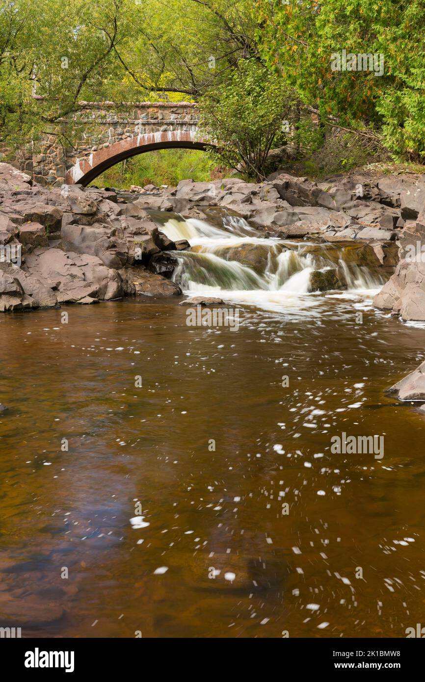 Amity Creek with Stone Arch Bridge In Autumn Stock Photo - Alamy