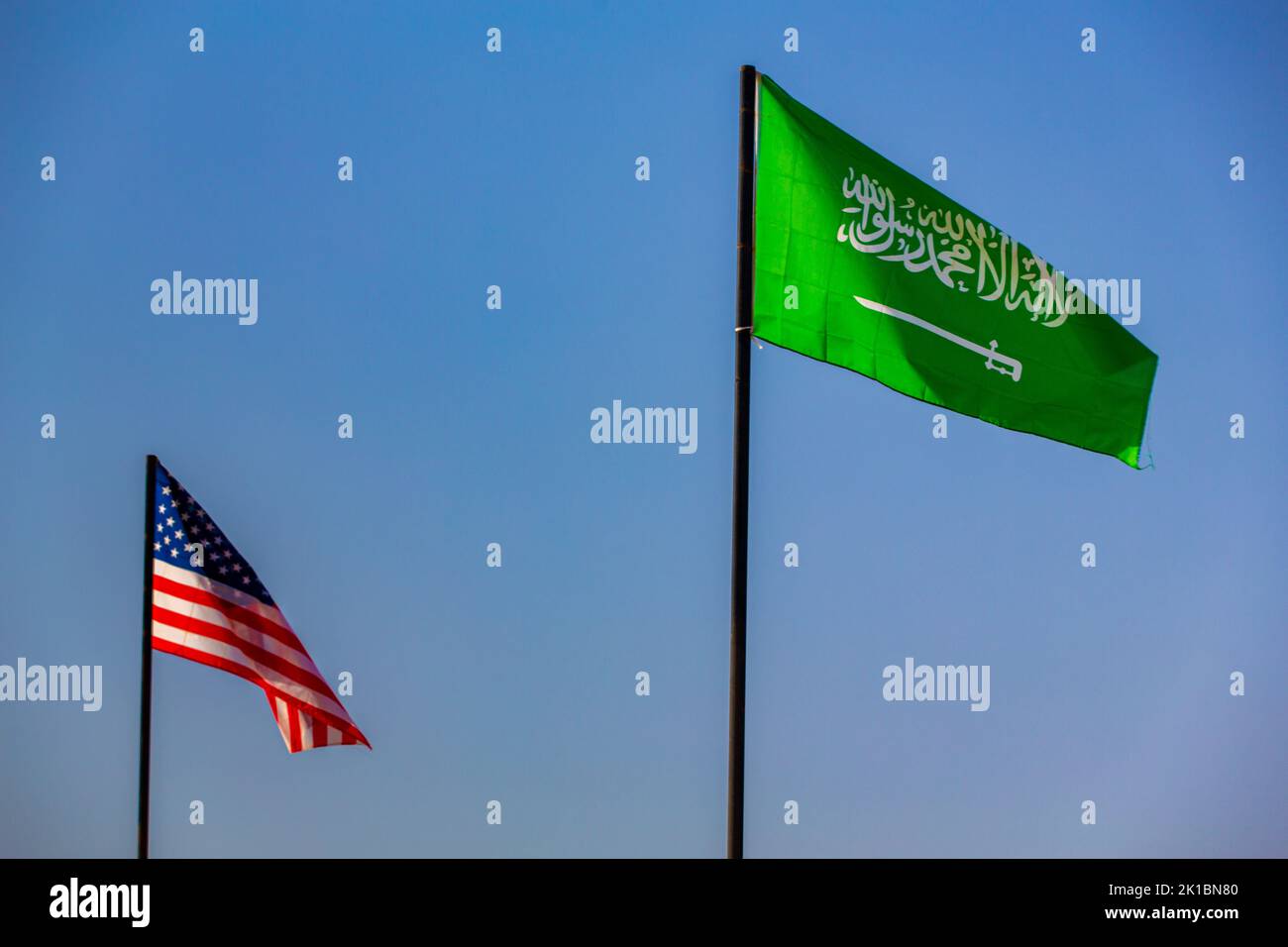 The national flag of saudi arabia and united state of america waving in ...