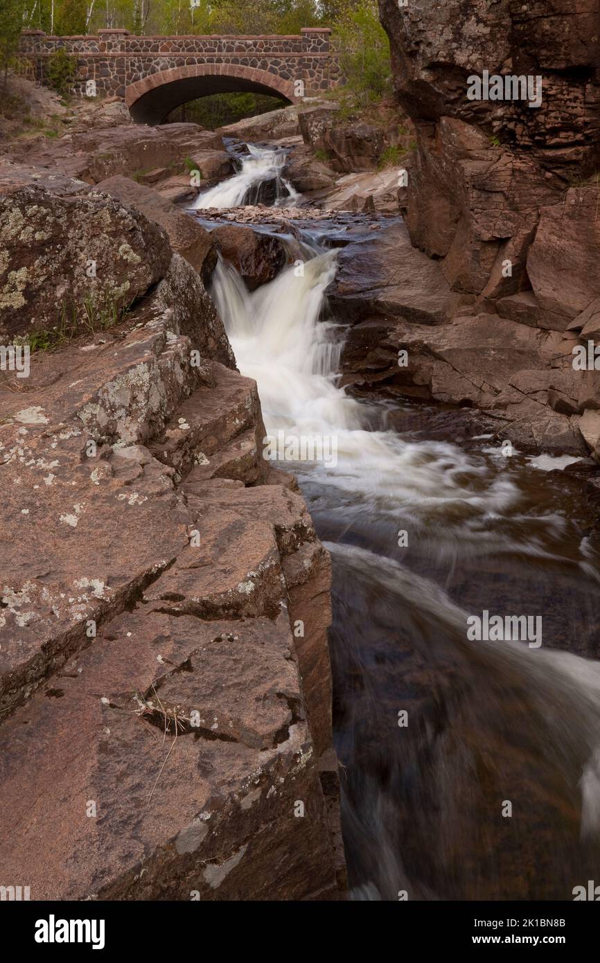 A Stone Arch Bridge and Cascading Waterfall On Amity Creek Stock Photo ...