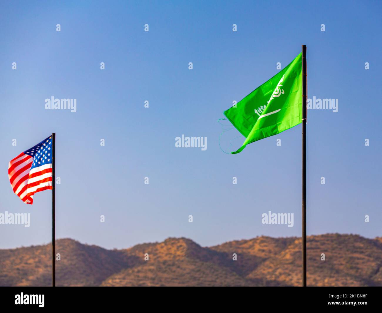 The national flag of saudi arabia and united state of america waving in ...