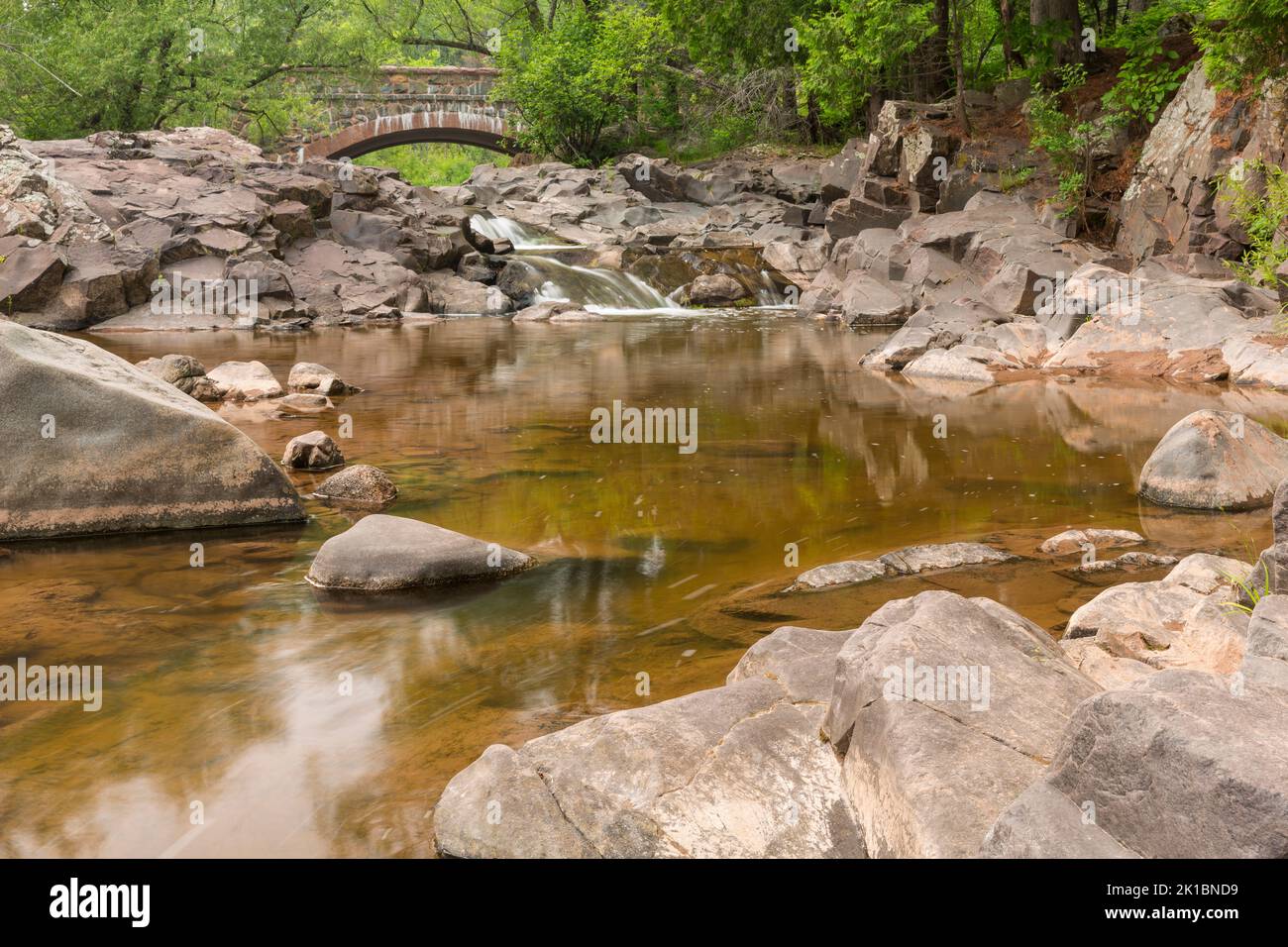 Amity Creek and Stone Arch Bridge In Summer Stock Photo - Alamy