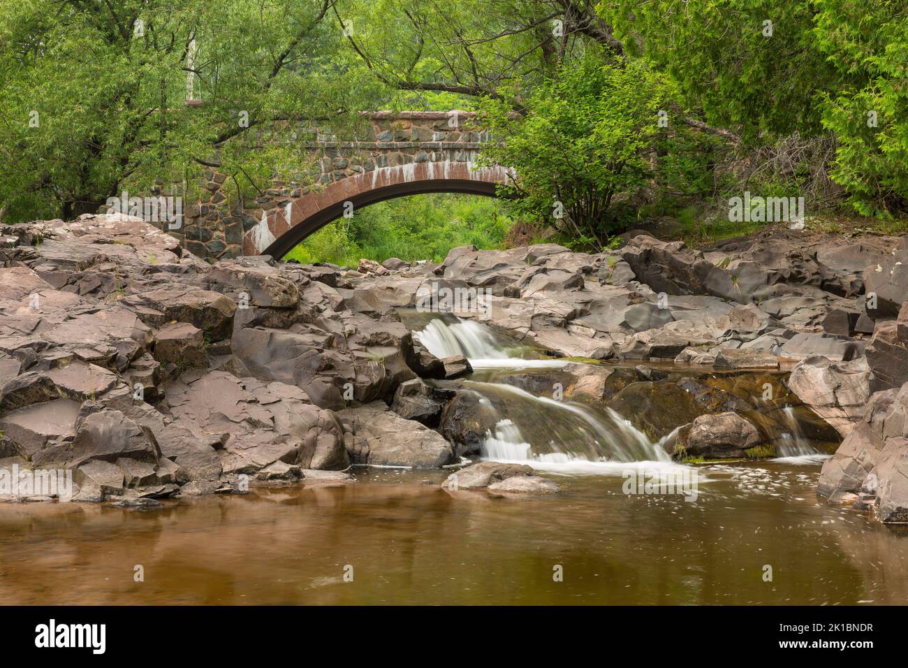 Amity Creek and Stone Arch Bridge In Summer Stock Photo - Alamy