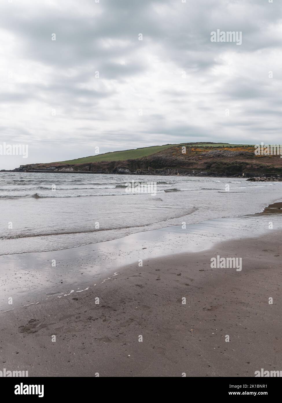 View of Rosscarbery pier from Warren Beach, southern coast of Ireland ...