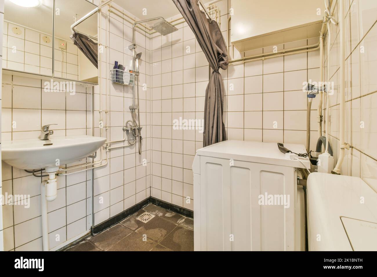 shower tap and wall hung toilet in modern restroom at home Stock Photo ...