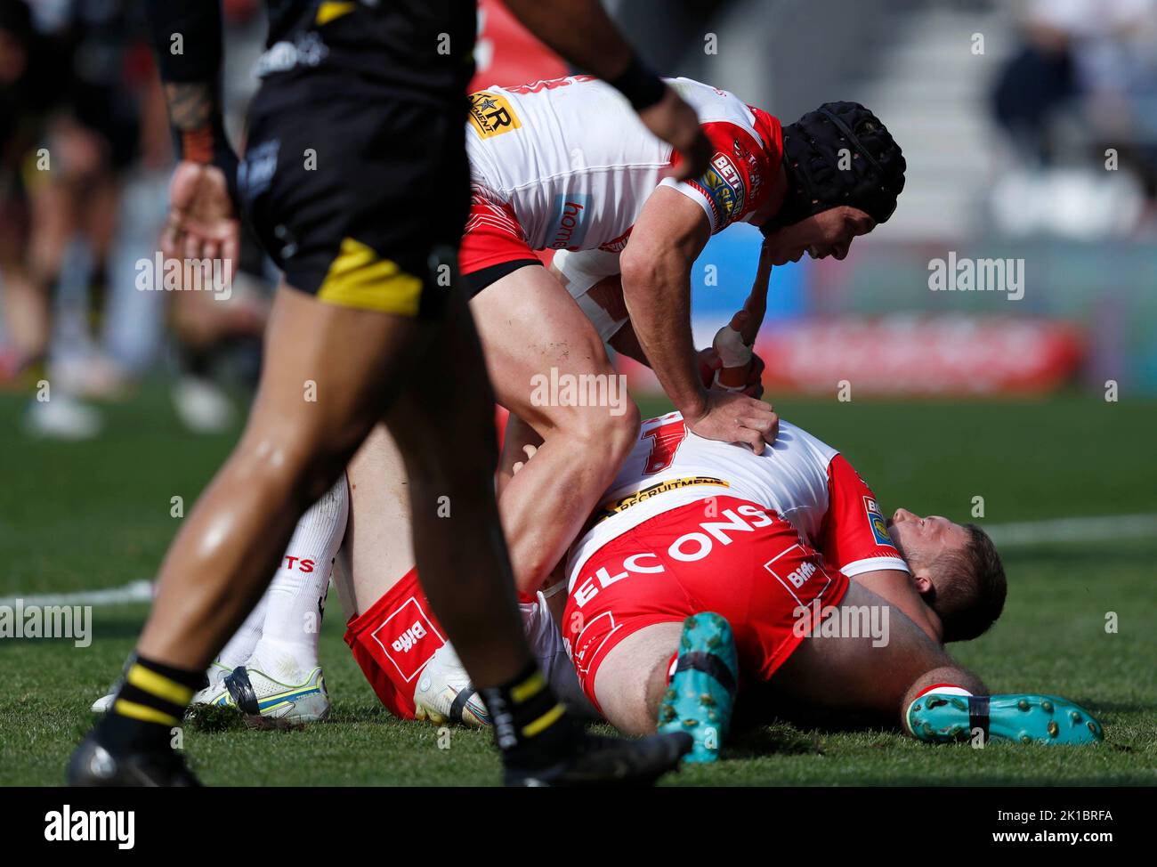 St Helens' Joe Batchelor (right) is congratulated by his team mates ...