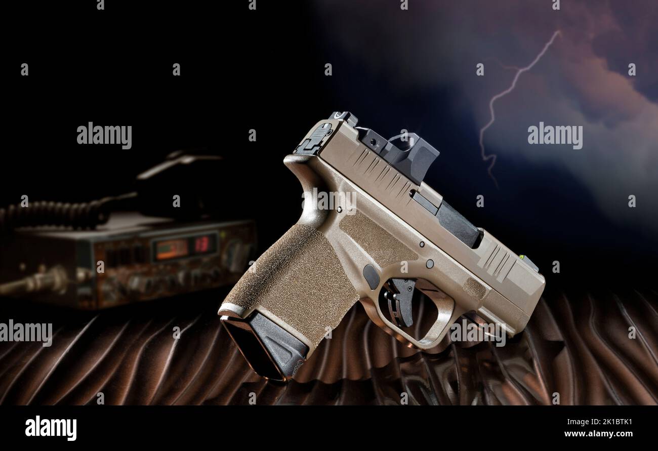 CB radio and gun with lightning storm behind Stock Photo - Alamy