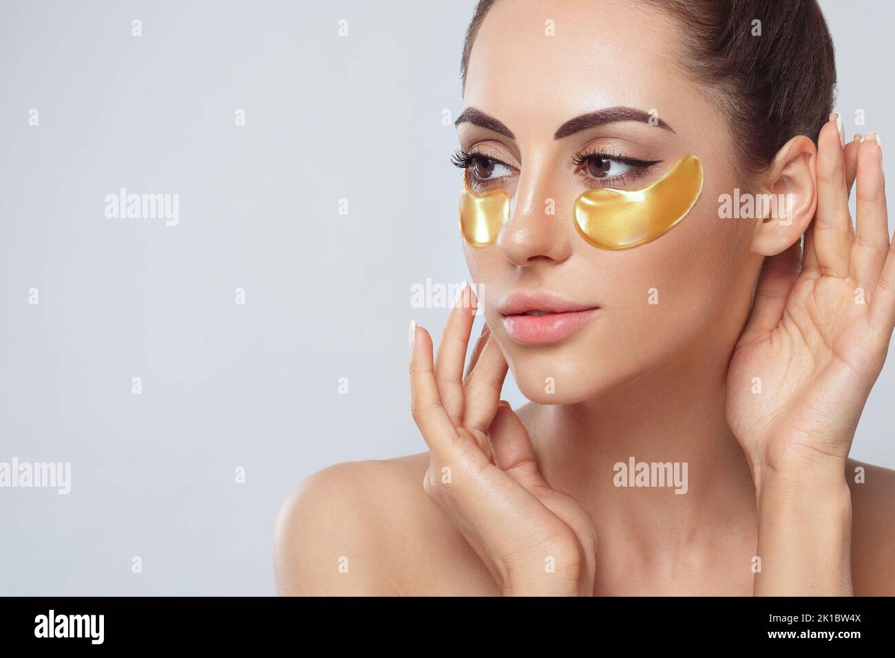 Beauty model girl face with healthy fresh skin. Woman with under eye ...