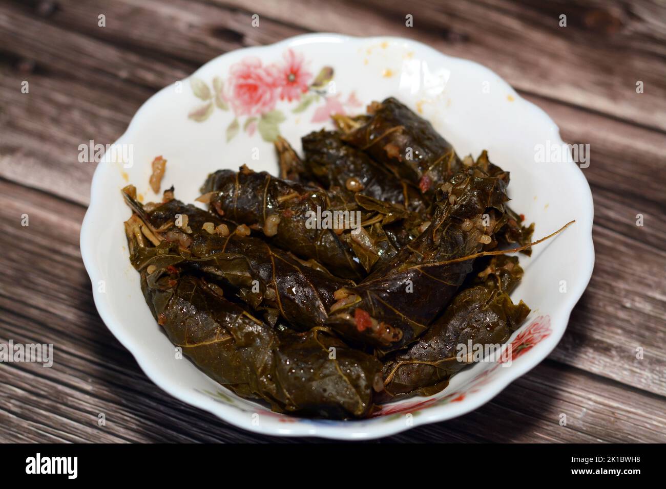 A plate of wrapped grape leaves stuffed Egyptian mahshi and filled with ...
