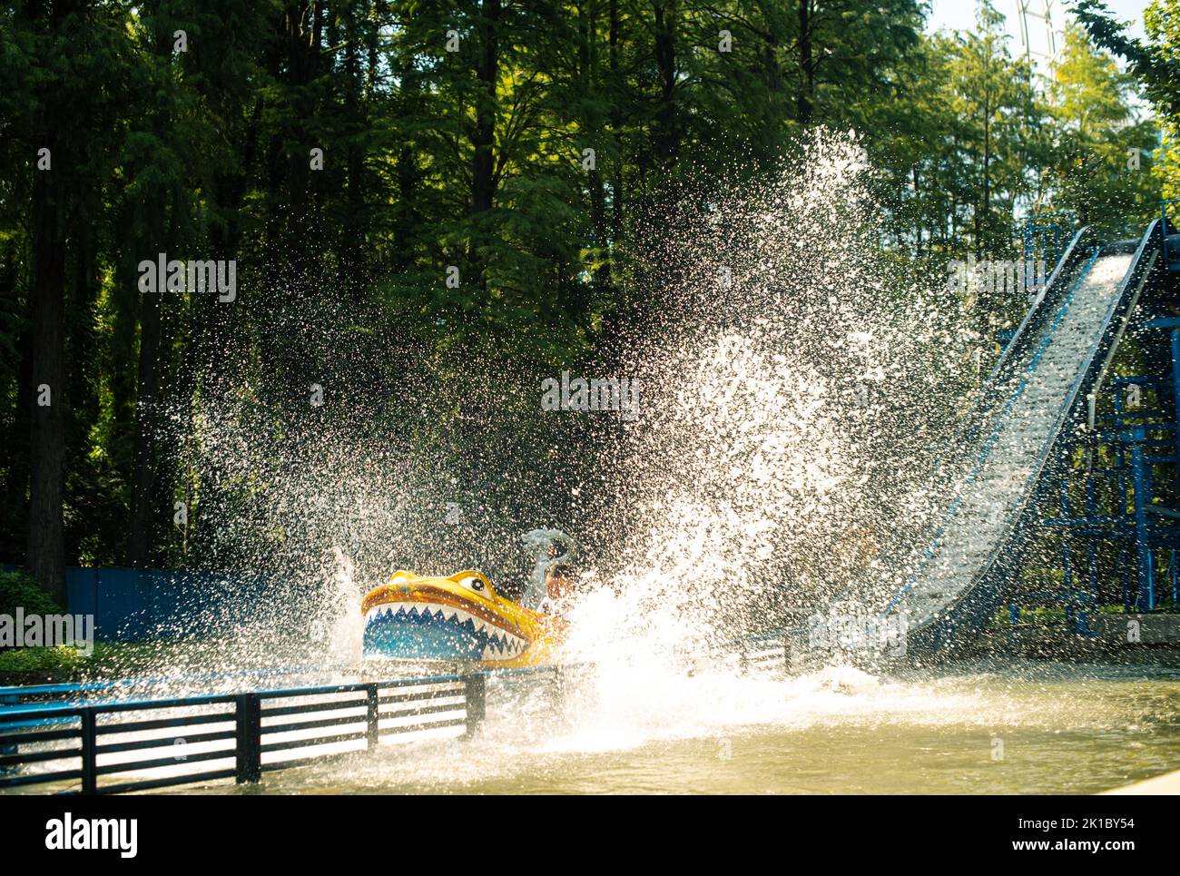 A water slide with a sunlit splash underneath Stock Photo - Alamy