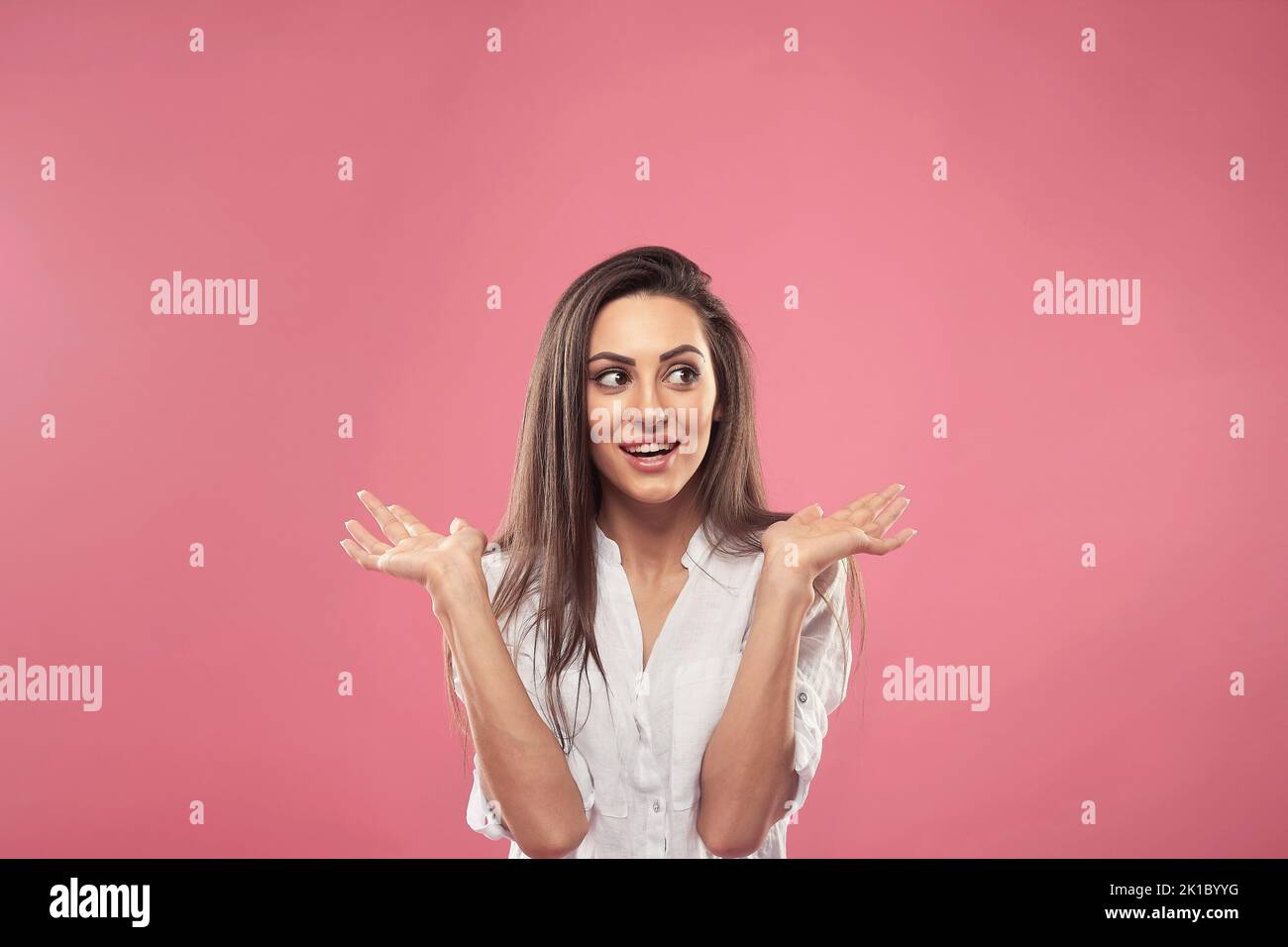 Woman with red lips.Beautiful girl with long hair surprised and shocked ...