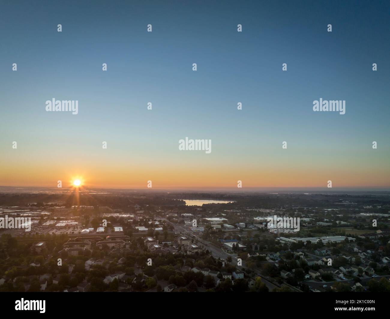 summer sunrise over plains and Fort Collins in northern Colorado ...