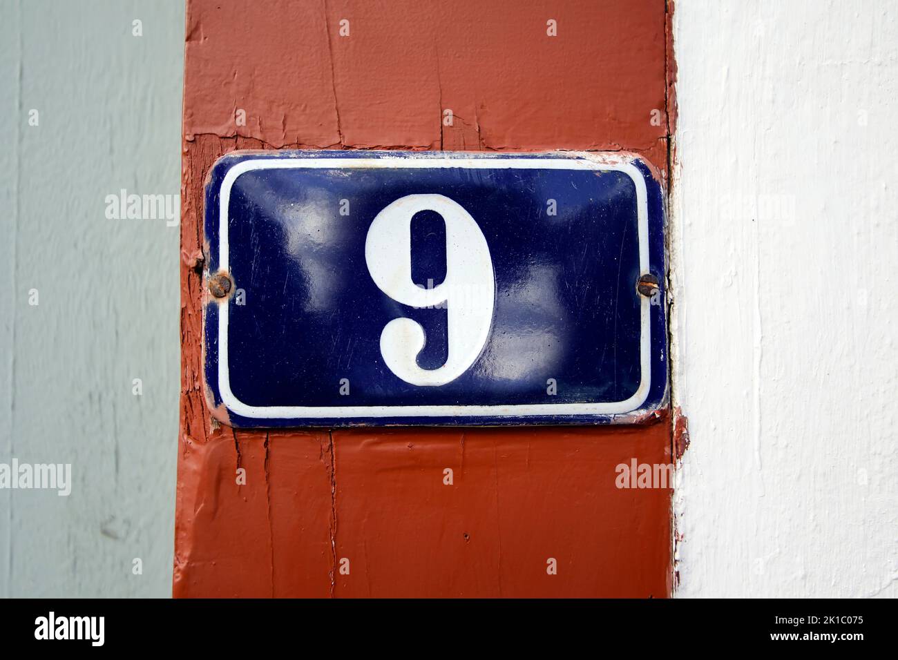 number nine in metallic plate format, with copy space and blue and ...