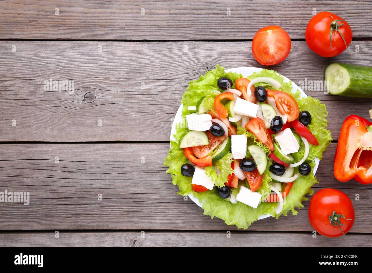 Fresh vegetable salad on grey background Stock Photo - Alamy