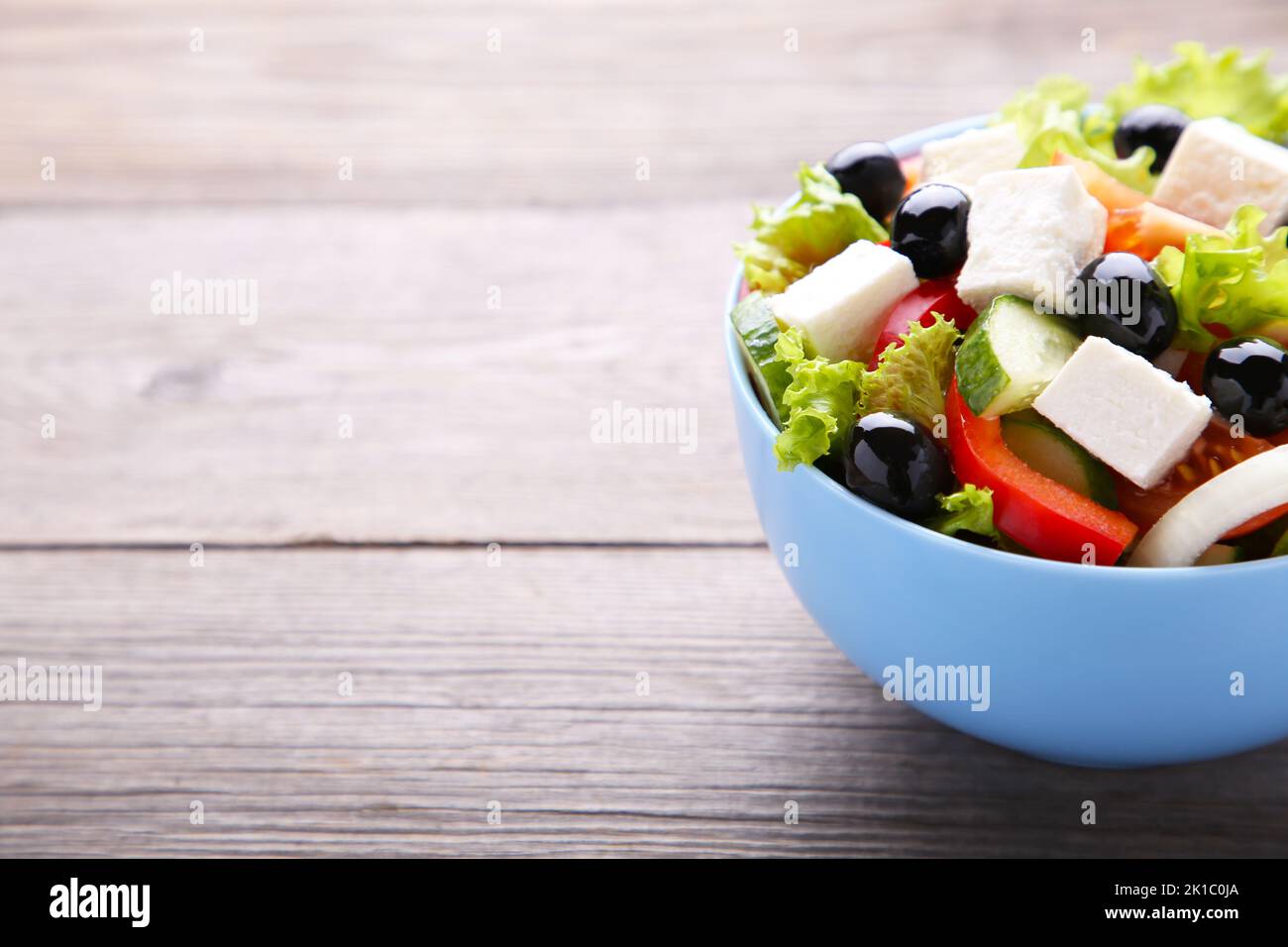 Fresh vegetable salad on grey background Stock Photo - Alamy
