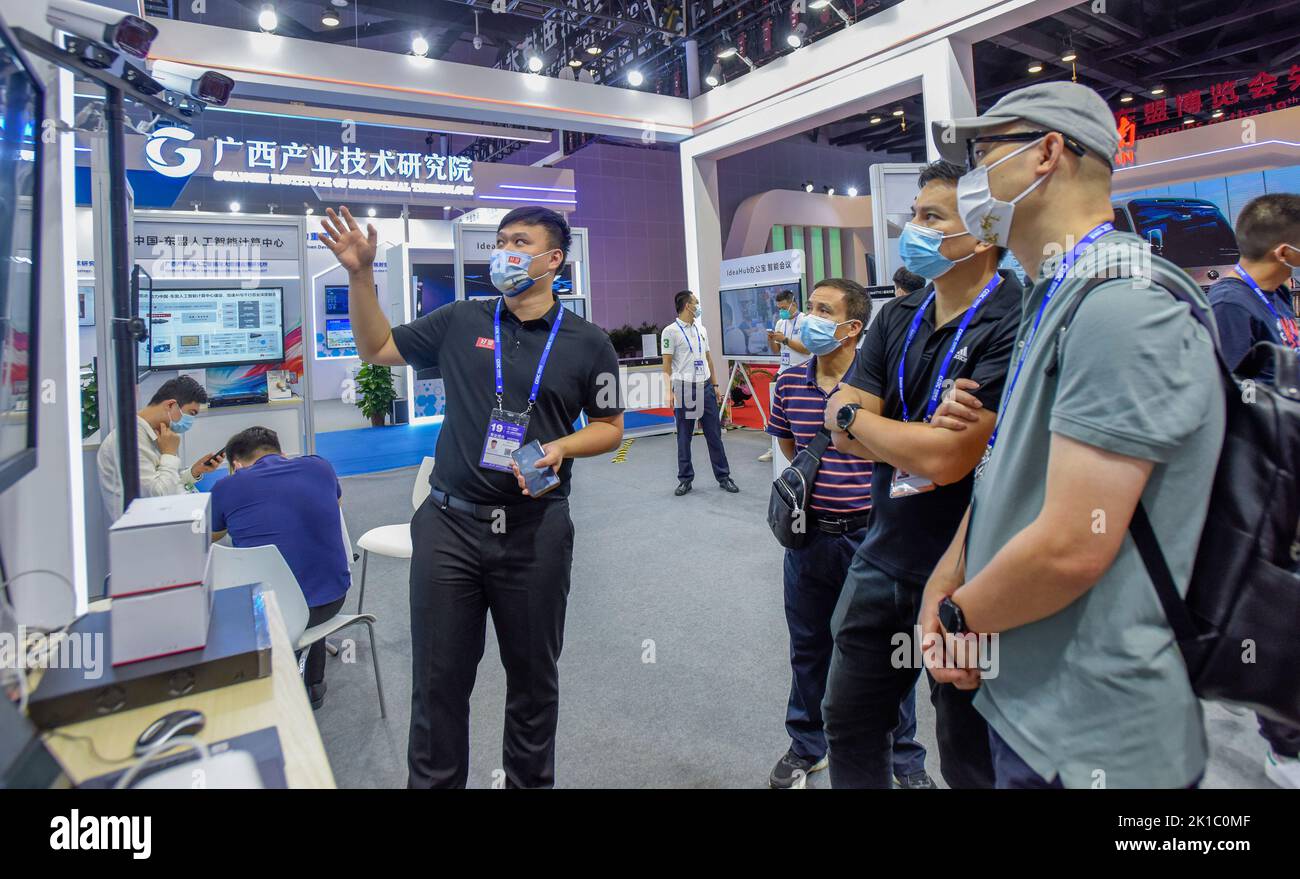 NANNING, CHINA - SEPTEMBER 17, 2022 - A staff member introduces ...