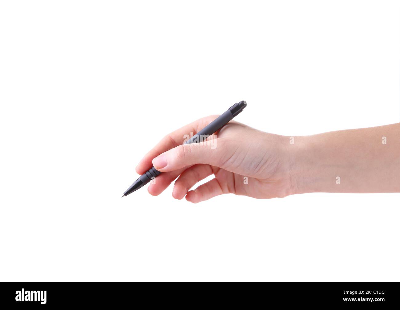 Female hand with pen isolated on white background, clipping path inside ...
