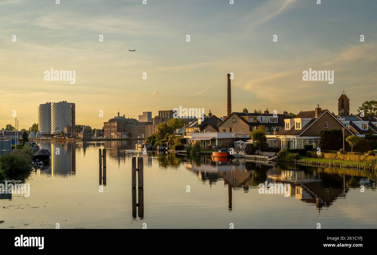 Dutch village of Halfweg seen from Zwanenburg with the ringvaart canal ...