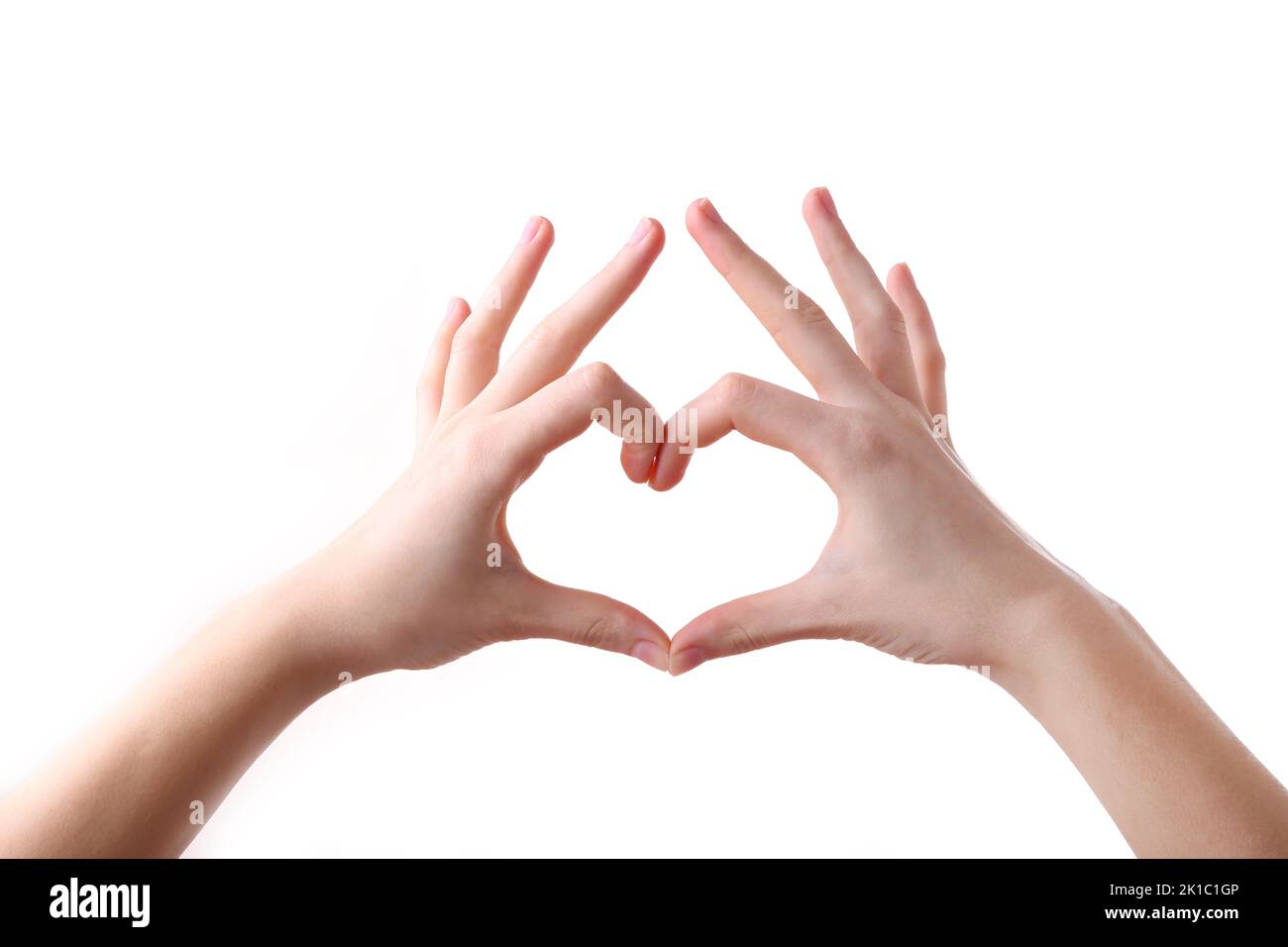 Female hands in heart shape isolated on a white background Stock Photo ...