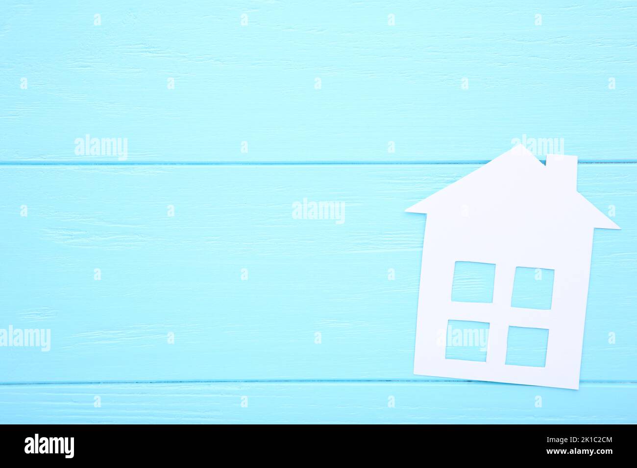 White paper house on blue background, top view Stock Photo - Alamy