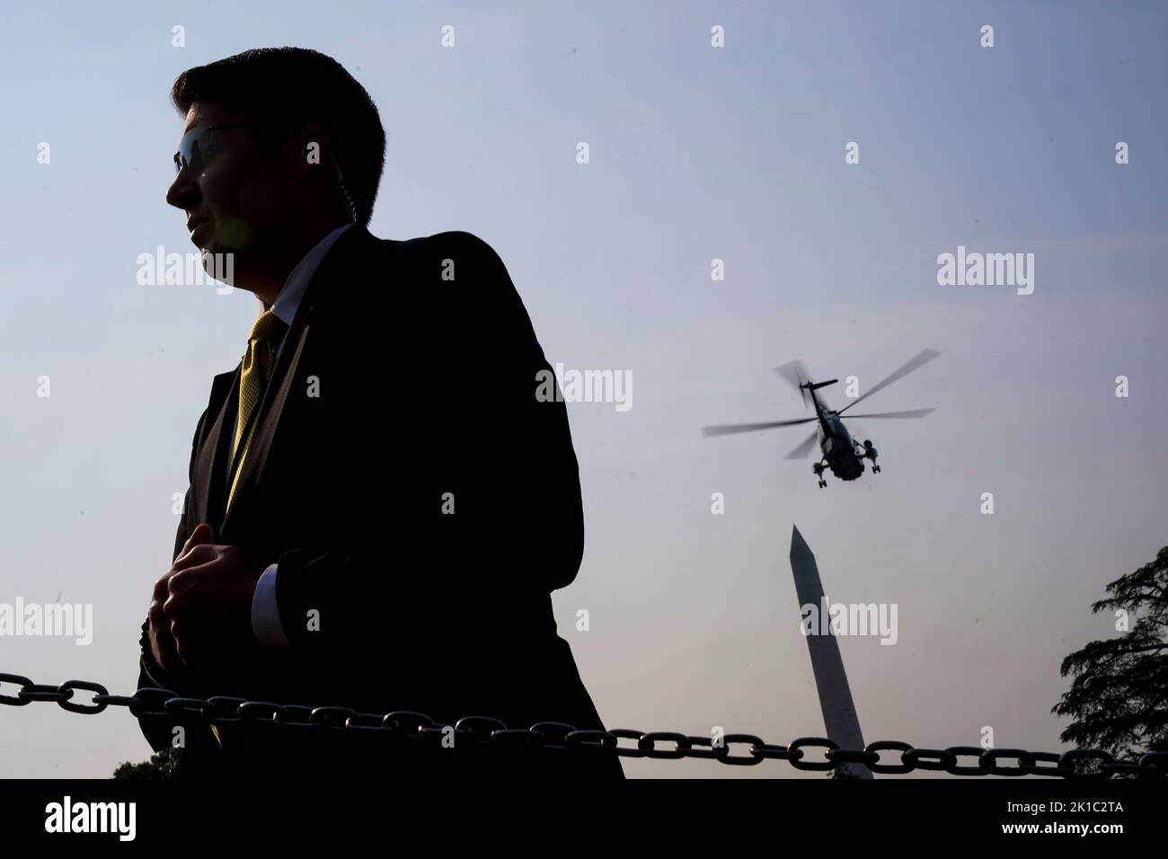 A Secret Service agent is seen on the South Lawn as President Joe Biden ...
